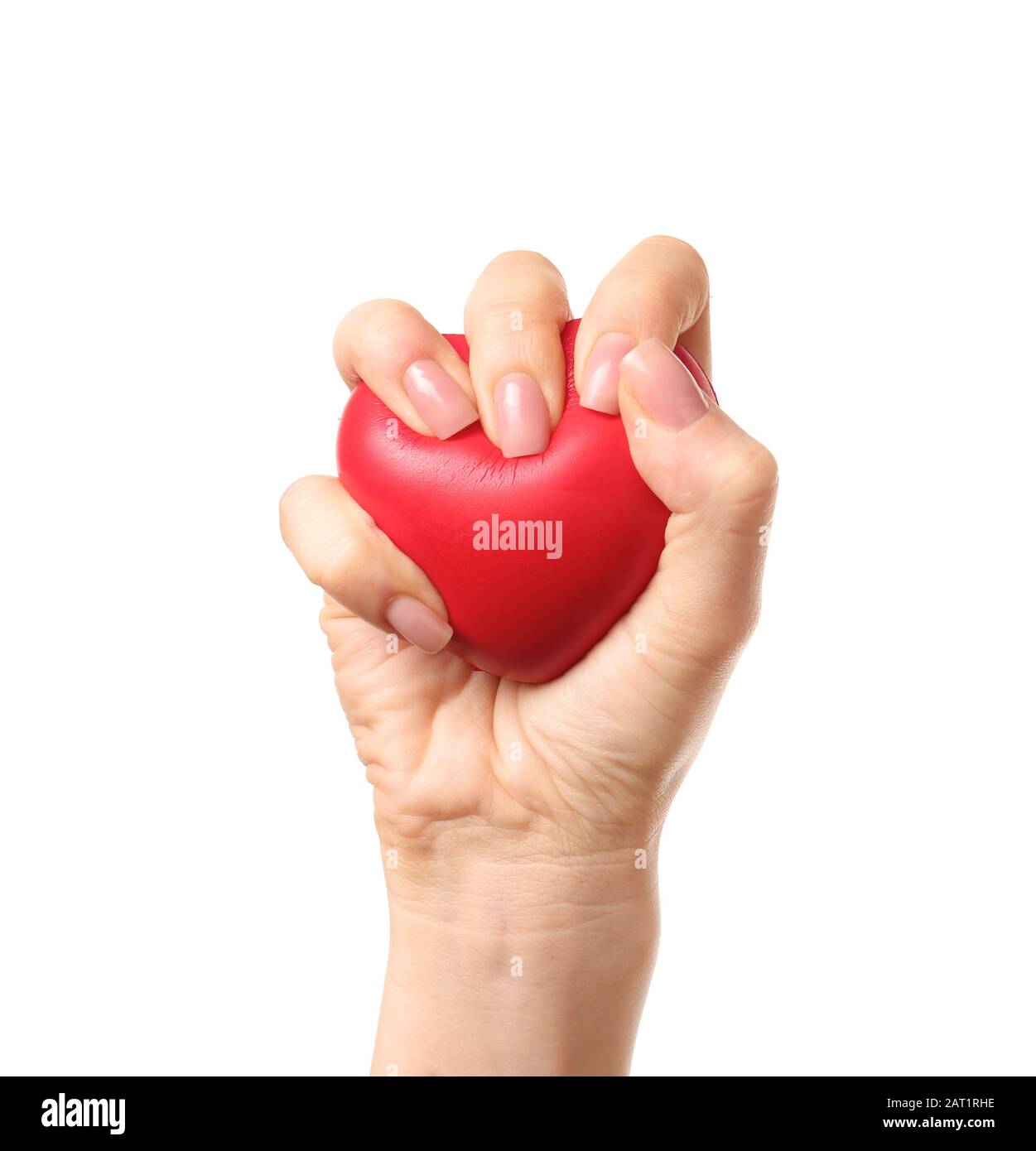 Female hand squeezing stress ball on white background Stock Photo - Alamy