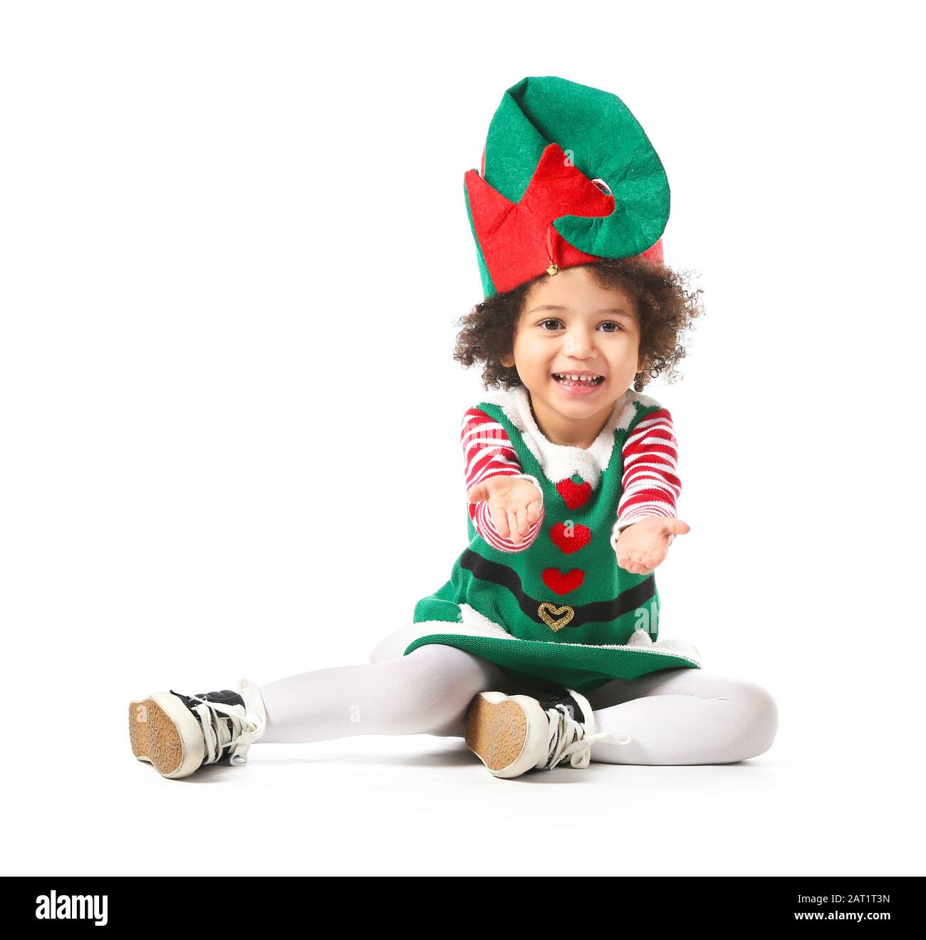 Little girl in costume of elf on white background Stock Photo - Alamy