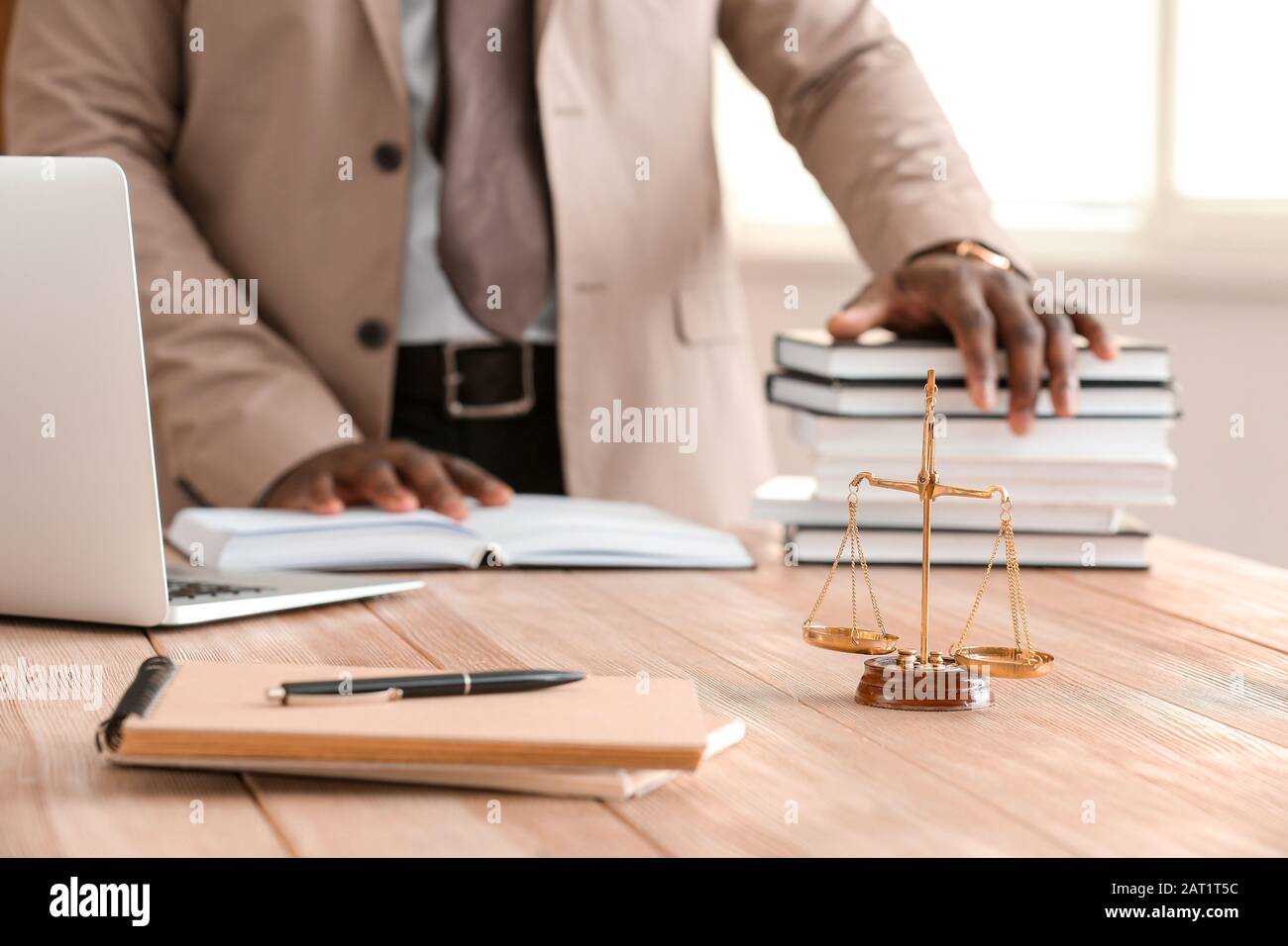 Scales of justice on table in lawyer's office Stock Photo - Alamy