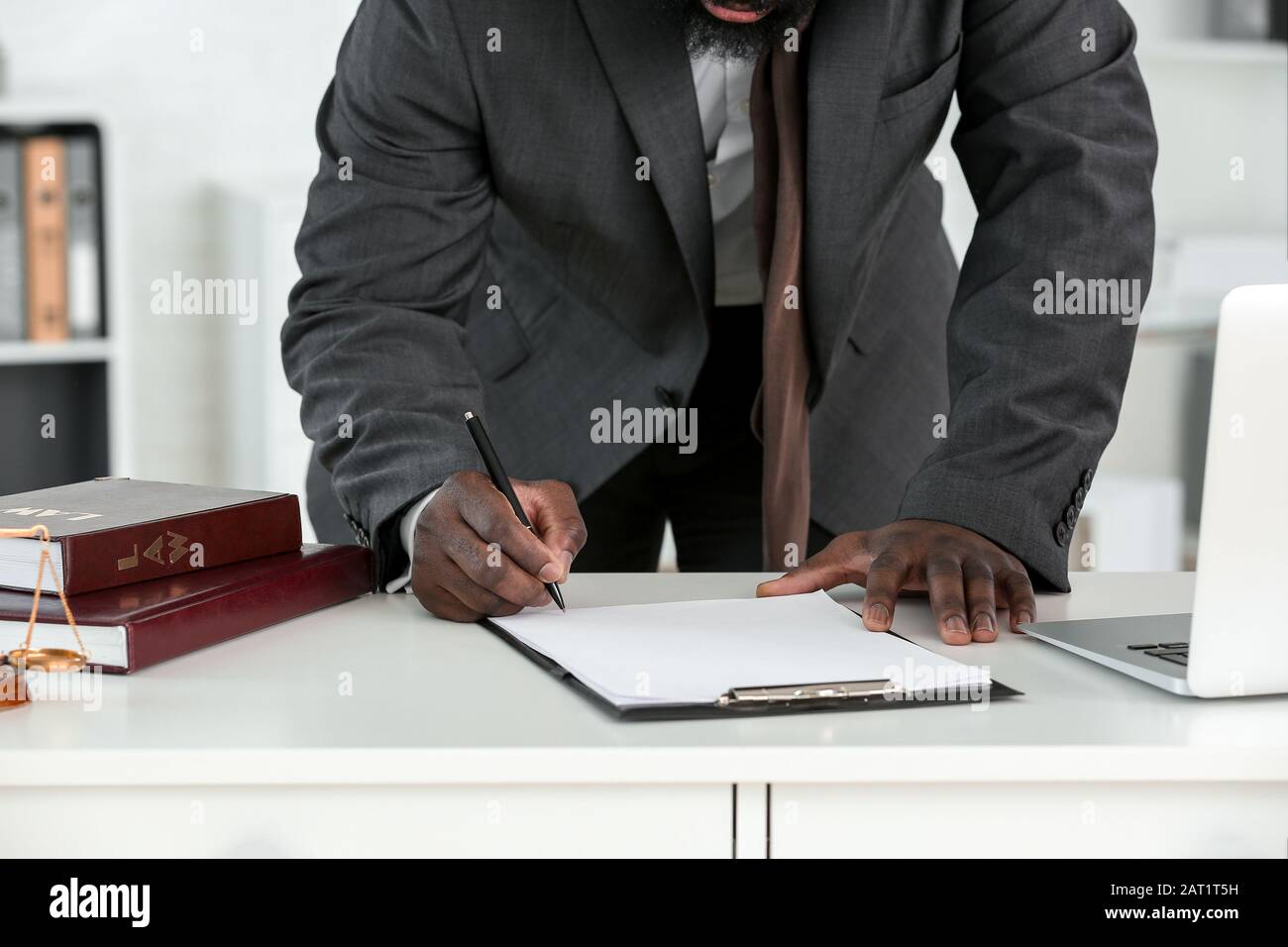 Lawyer signing documents in hi-res stock photography and images - Alamy