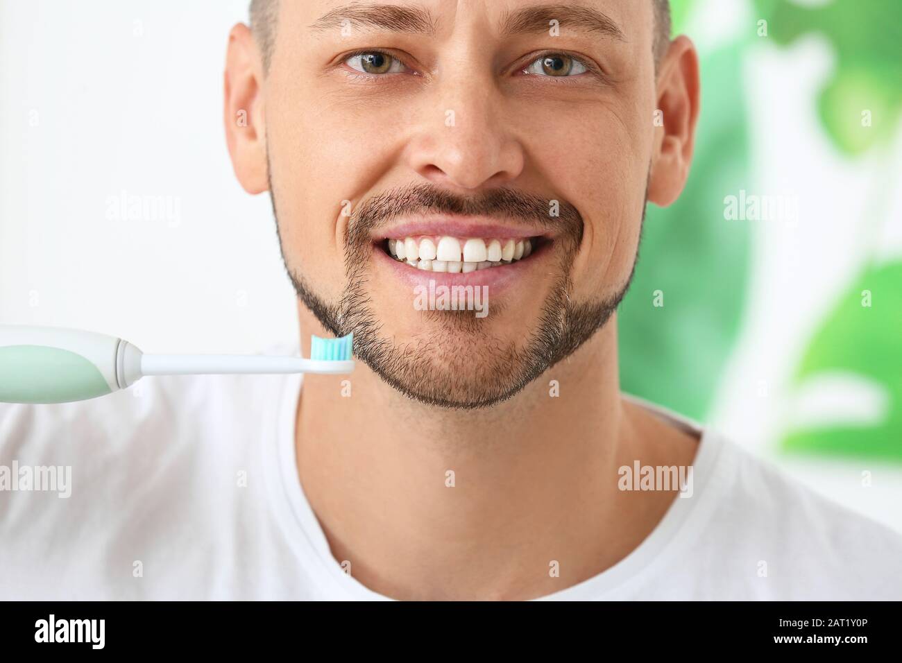 Handsome man brushing teeth hi-res stock photography and images - Alamy