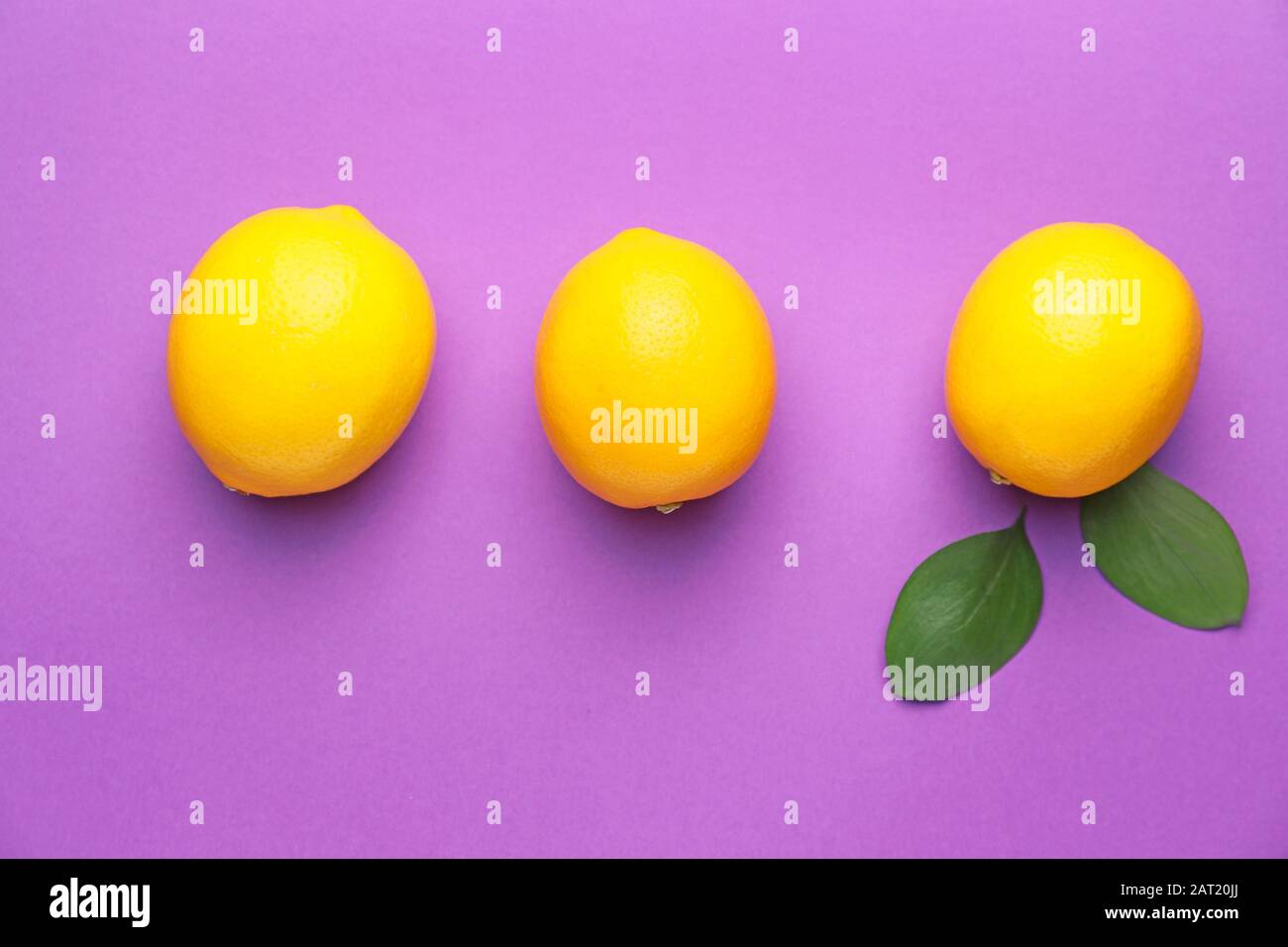 Ripe lemons on color background Stock Photo - Alamy