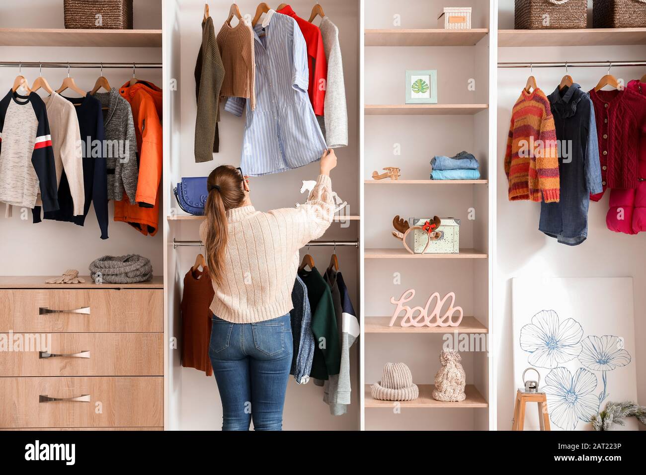 Woman choosing winter clothes hi-res stock photography and images - Alamy