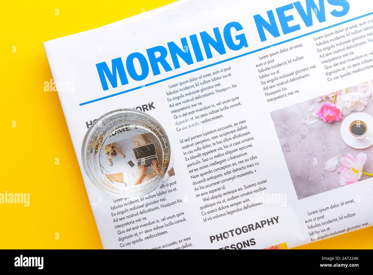 Glass of clean water and newspaper on color background Stock Photo - Alamy