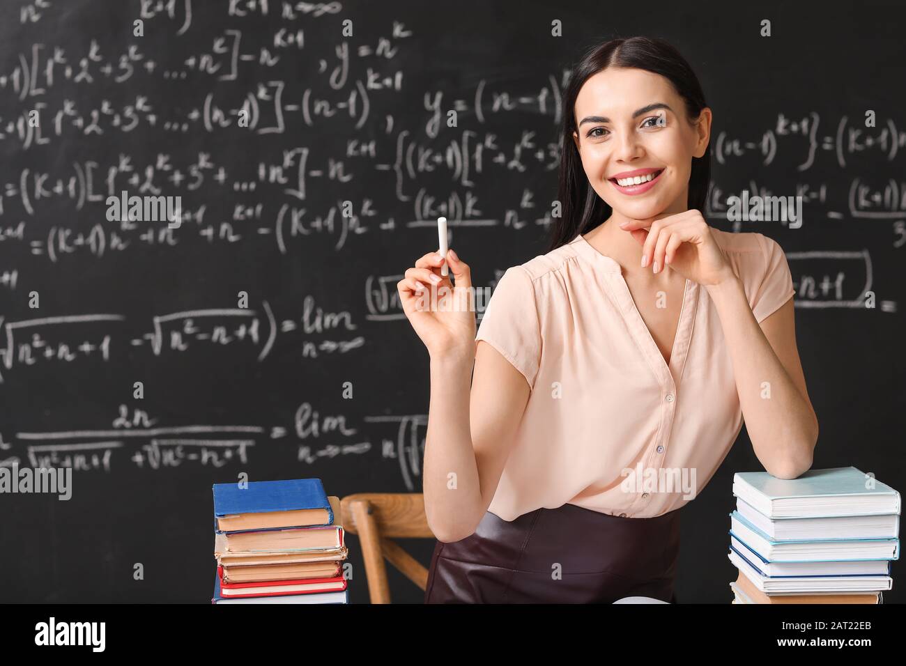 Female teacher at workplace in classroom Stock Photo - Alamy