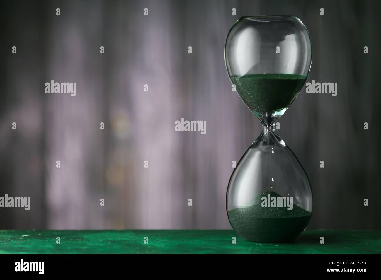 Hourglass on dark background. Time management concept Stock Photo - Alamy