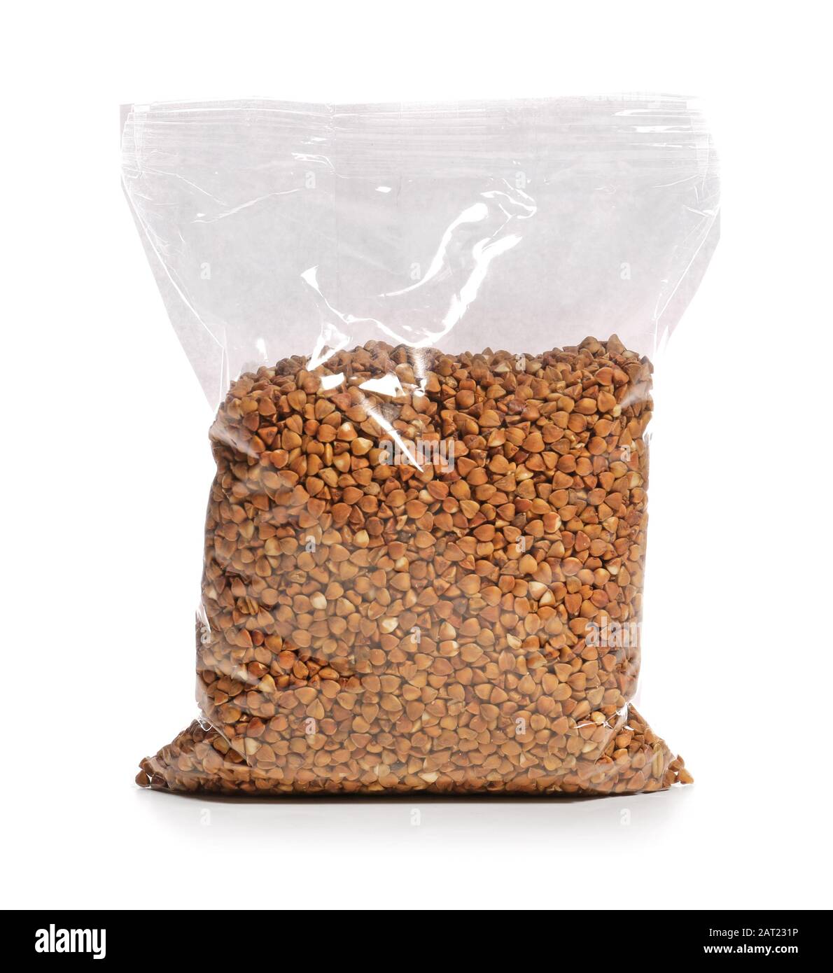 Plastic pack with raw buckwheat on white background Stock Photo - Alamy