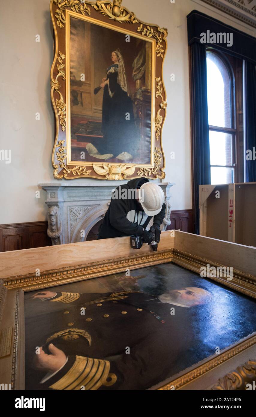 A painting of Edward VII by artist Emile Fuchs is placed in a crate as ...