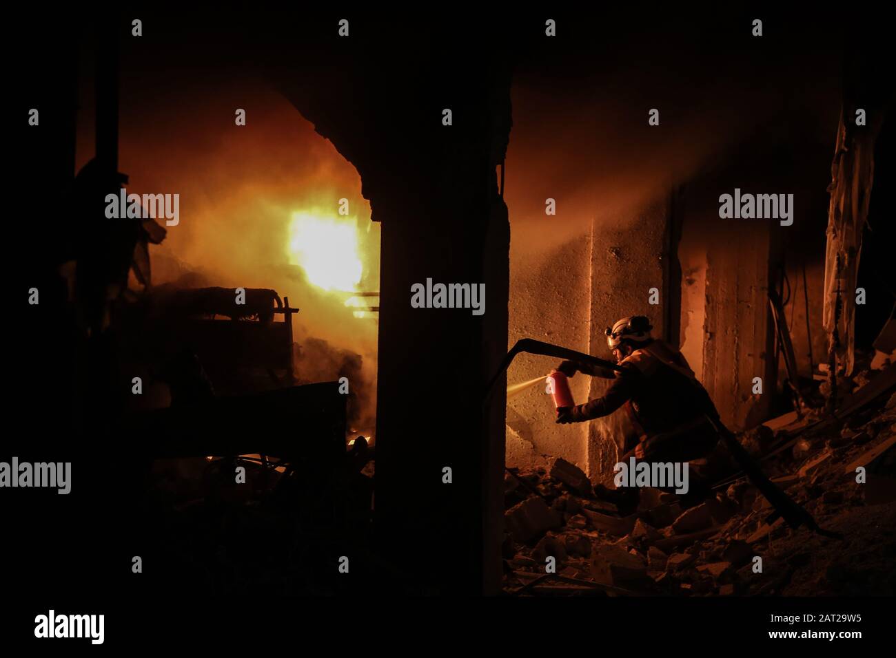 Ariha, Syria. 30th Jan, 2020. A member of the Syrian Civil Defence ...