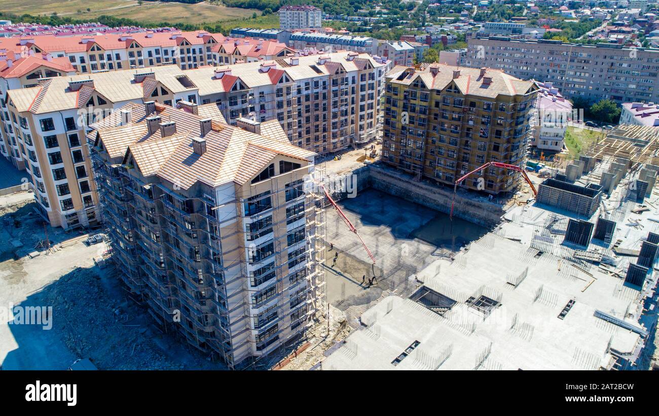 Construction of a residential neighborhood. Several buildings of the ...