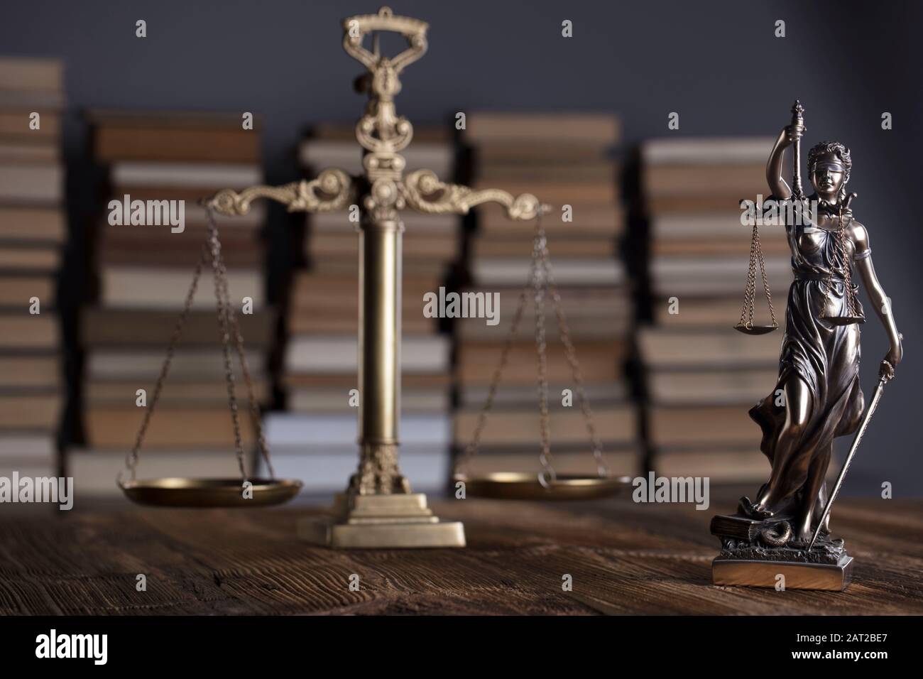 Law theme. Themis statue, gavel scale and legal books on rustic wooden ...