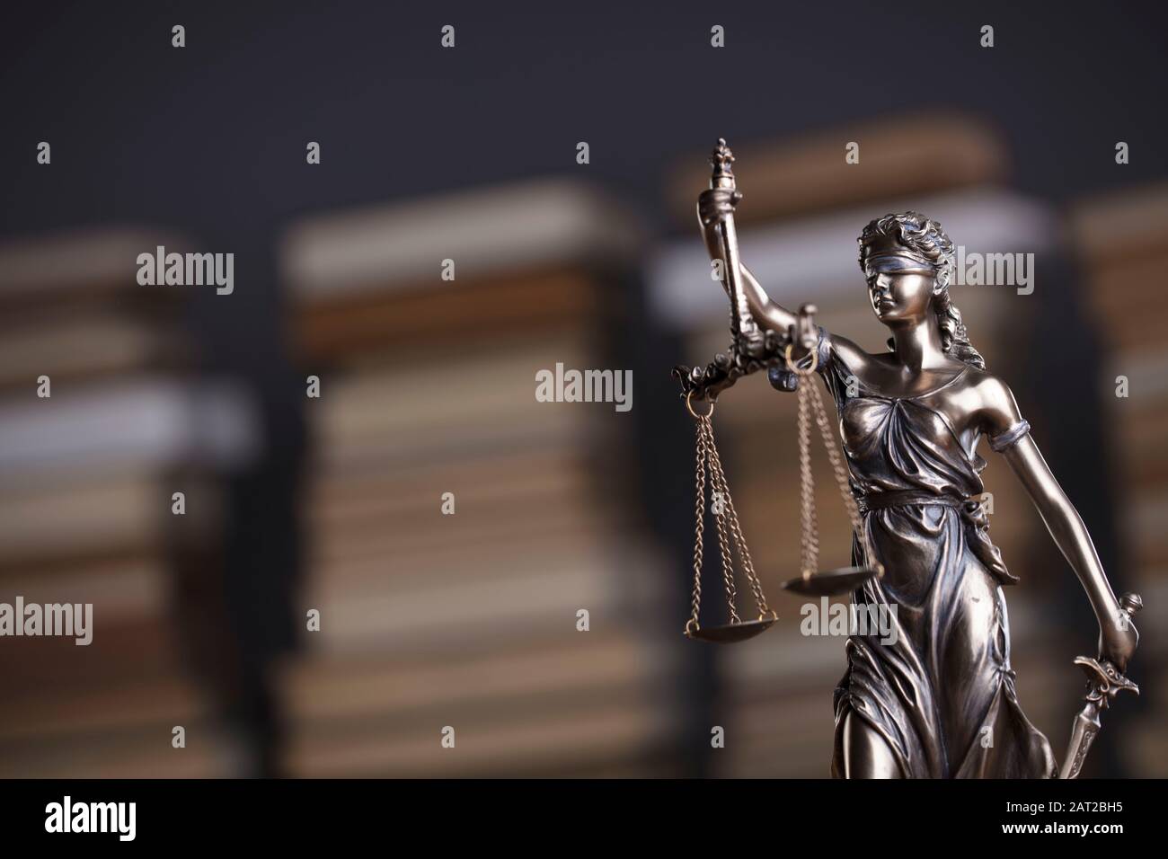 Law theme. Themis statue, gavel scale and legal books on rustic wooden ...