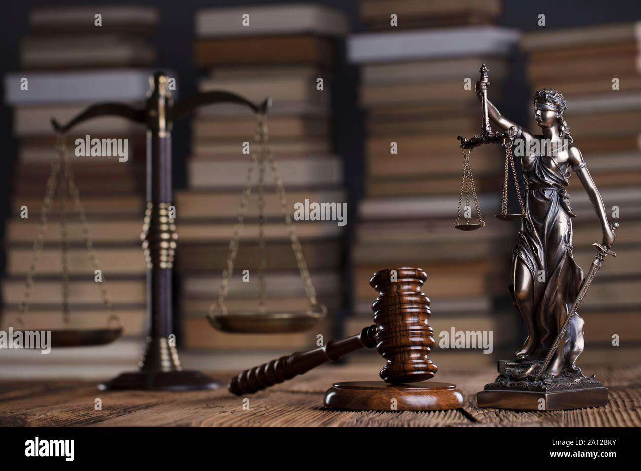 Law theme. Themis statue, gavel scale and legal books on rustic wooden ...