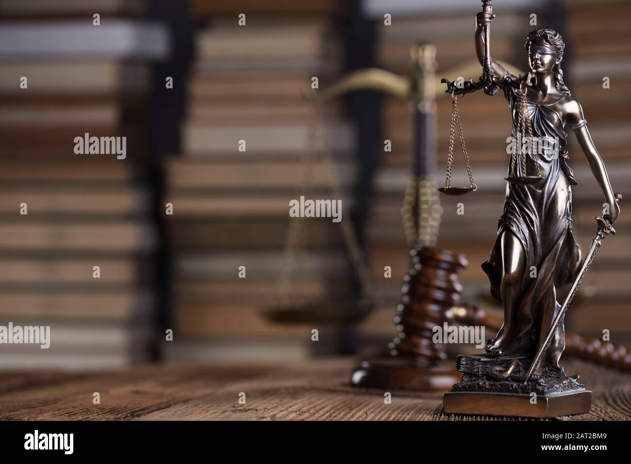 Law theme. Themis statue, gavel scale and legal books on rustic wooden ...