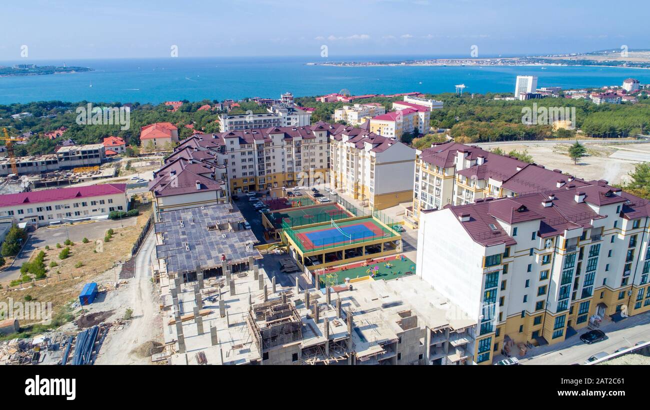 Construction of a residential neighborhood. Several buildings of the ...
