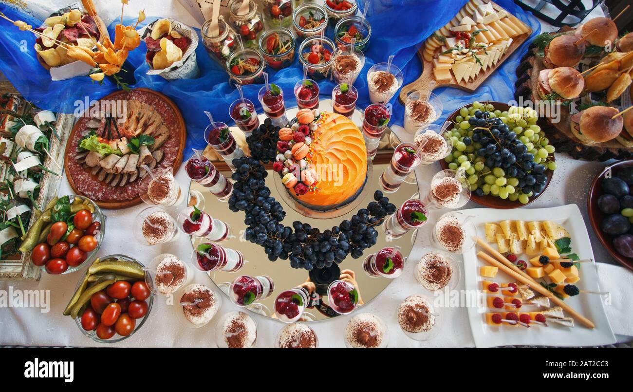 A wide selection of varied colorful snacks on the buffet Stock Photo ...