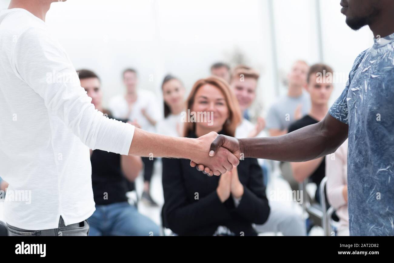 Group shake hands speaker hi-res stock photography and images - Alamy