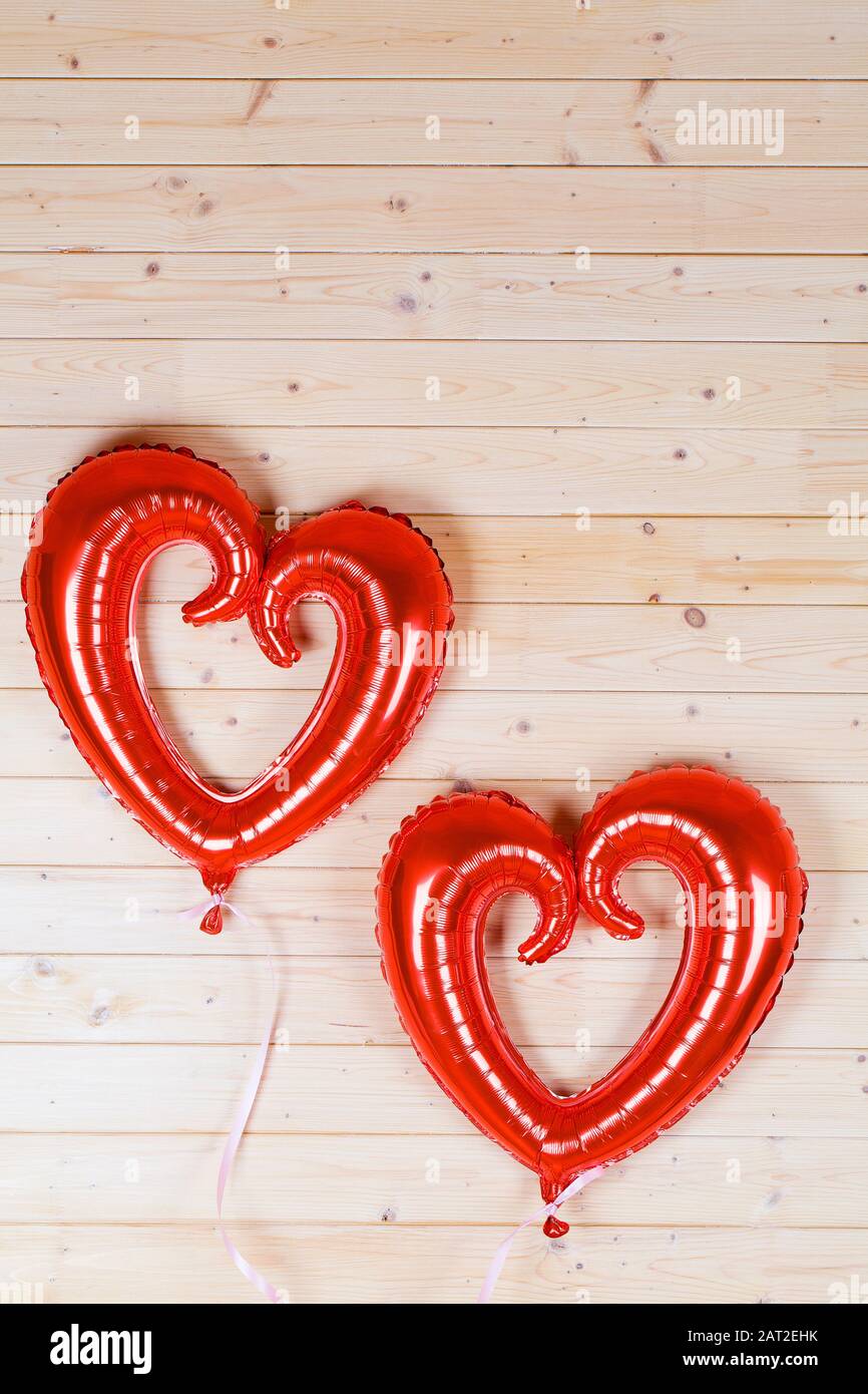 Big red heart balloons on wood background . Valentines day or birthday ...