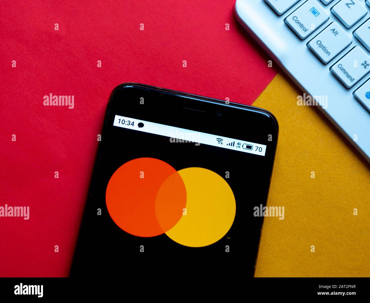 In this photo illustration the Mastercard logo is seen displayed on a ...