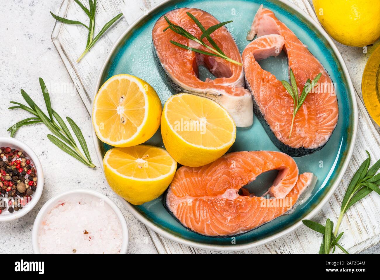 Raw salmon steak on white top view Stock Photo - Alamy