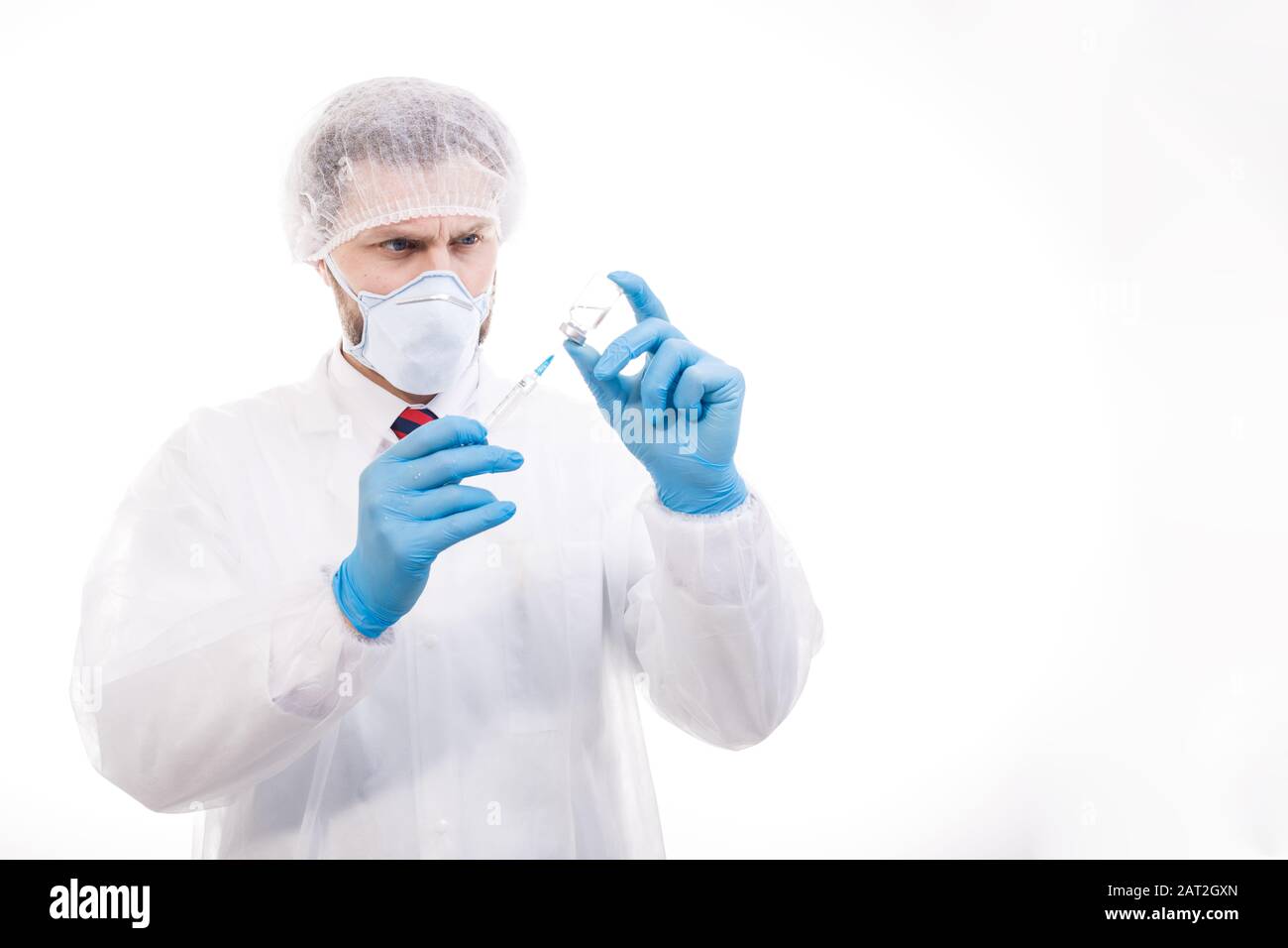 Concentrated Medical Employee Loading a Syringe of Vaccine Stock Photo ...