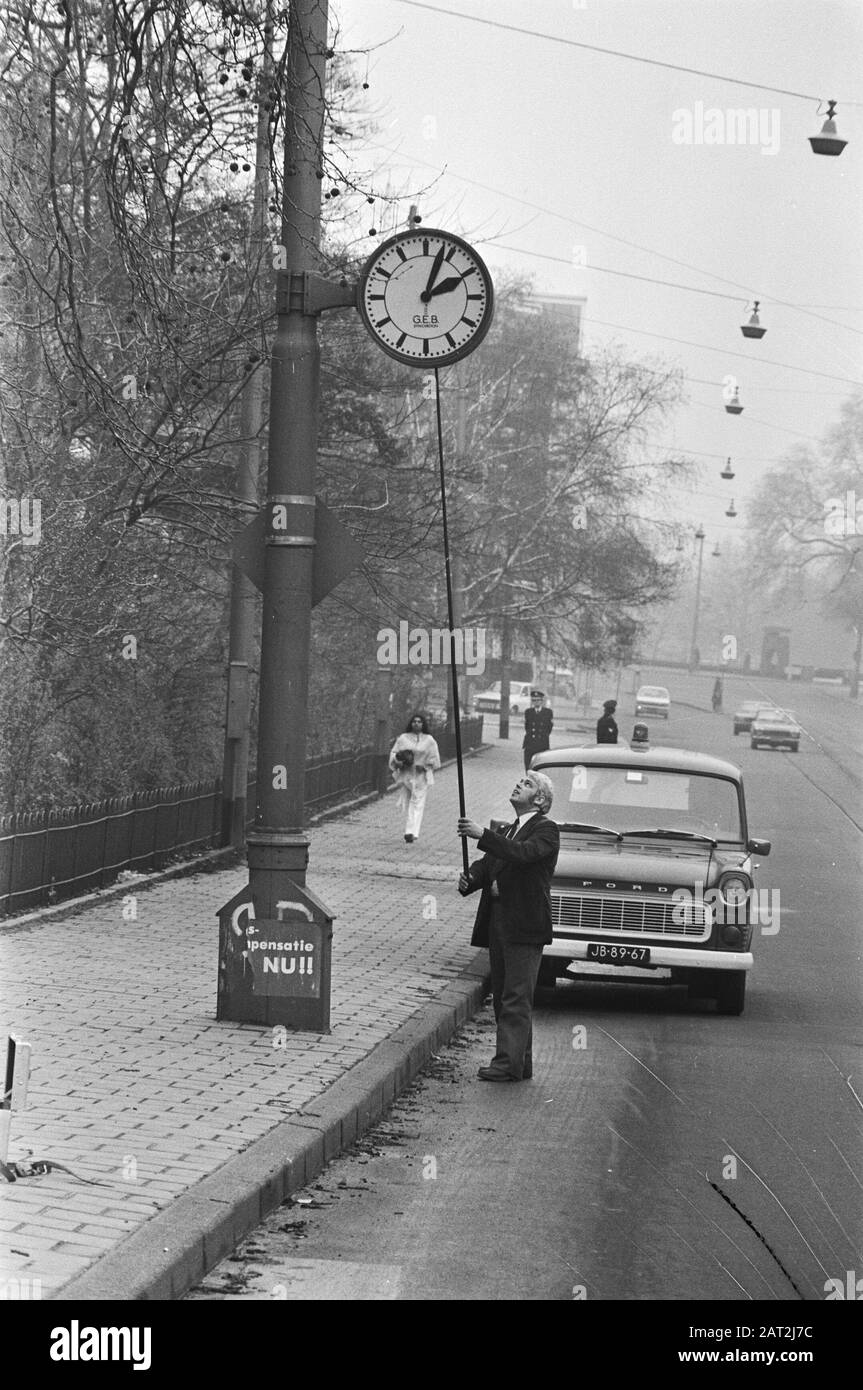 Entry summer time 1977 Municipal worker sets a clock an hour ahead Date ...