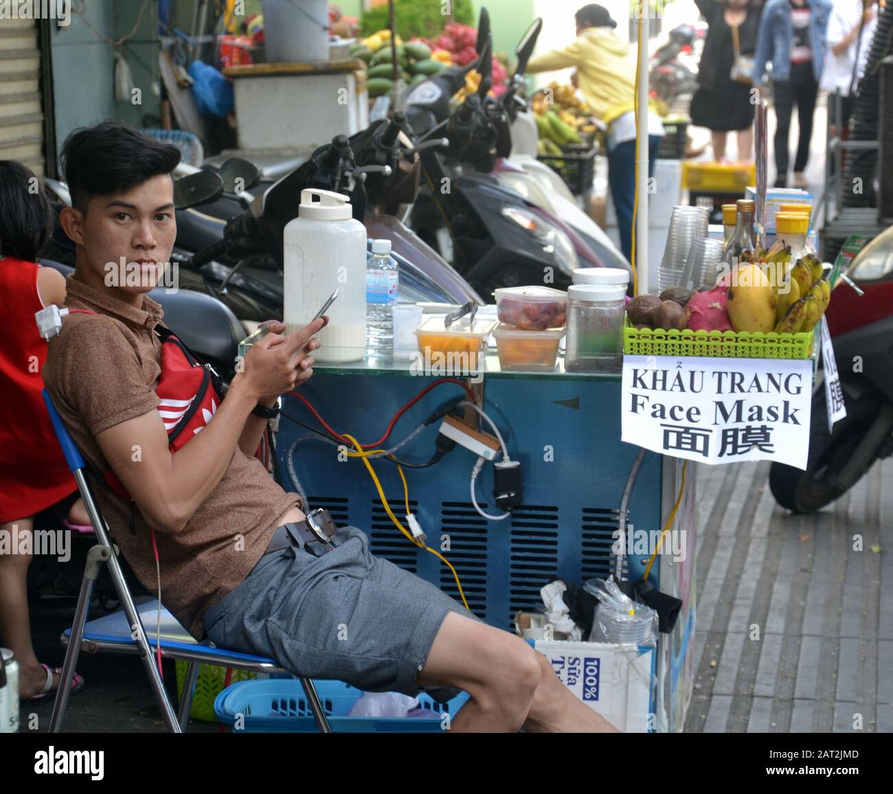 A street food seller advertises face masks in the light of anxiety ...