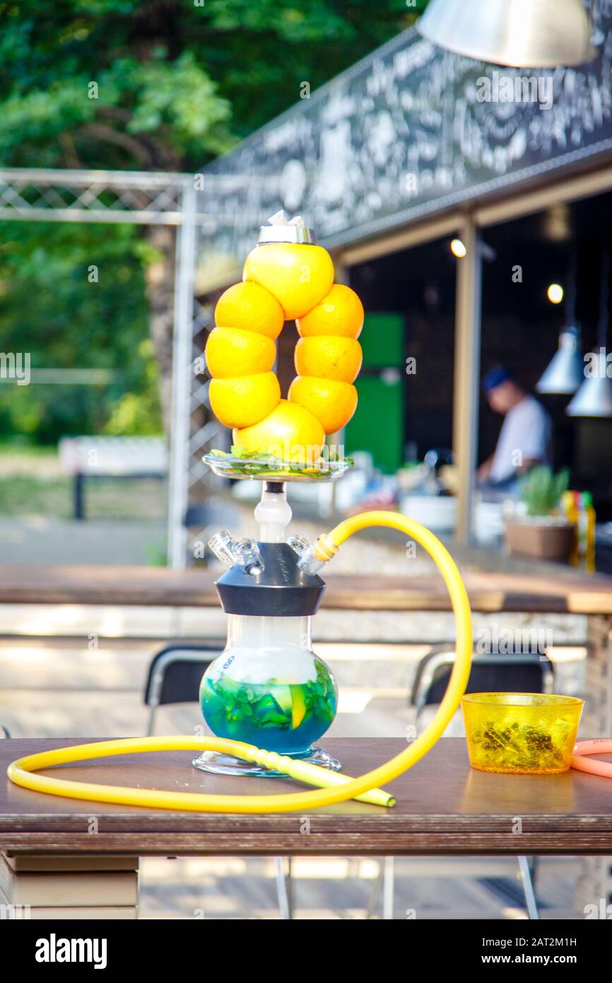 Hookah on the oranges. A hookah bowl consists of several oranges strung ...