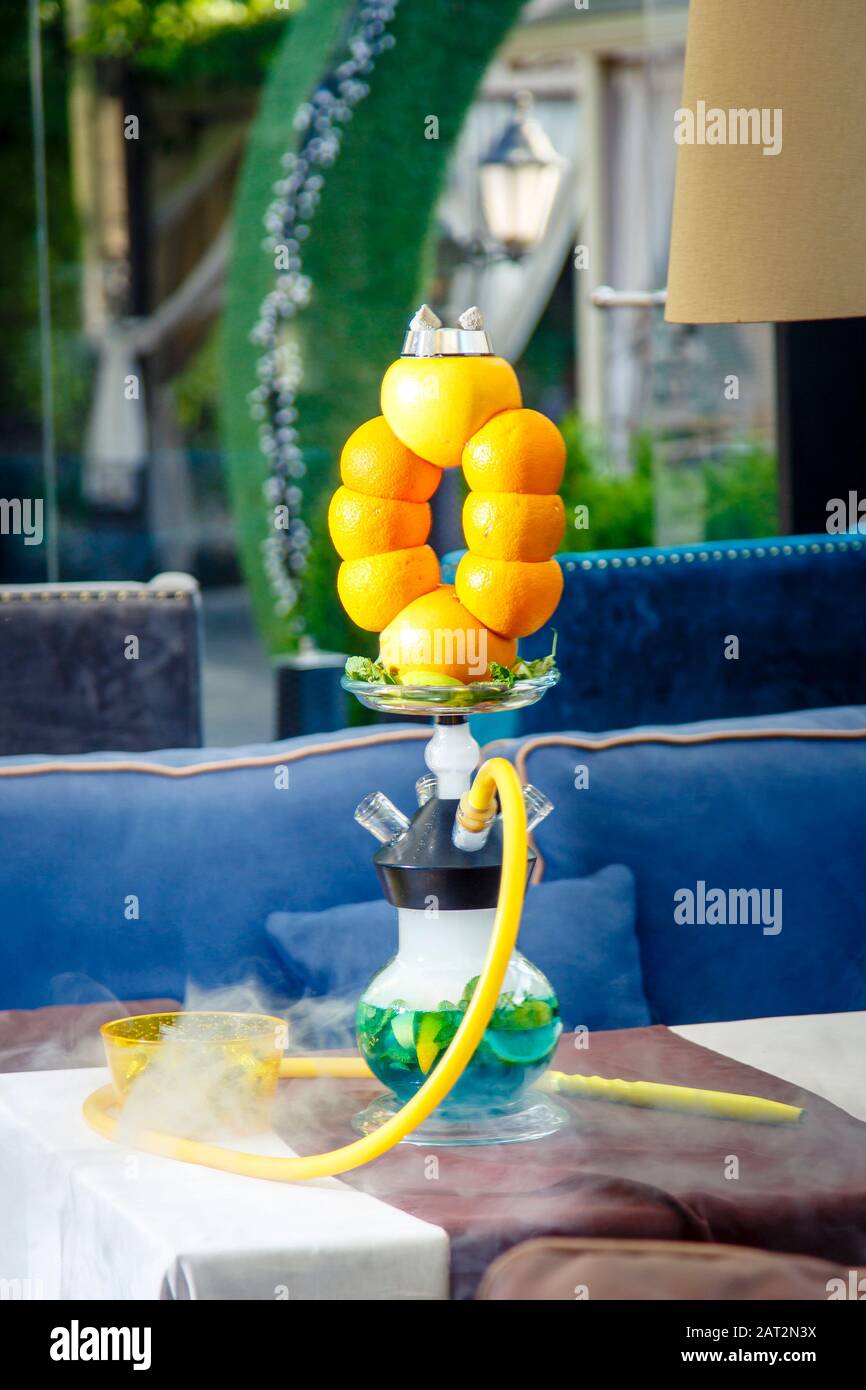 Hookah on the orange. Orange hookah. Hookah with a round transparent ...