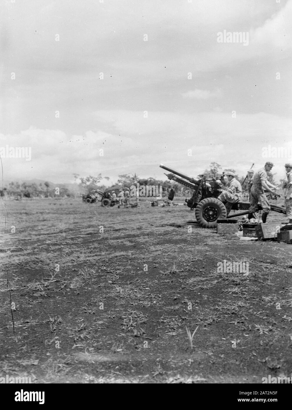 Line Of Artillery Guns Firing