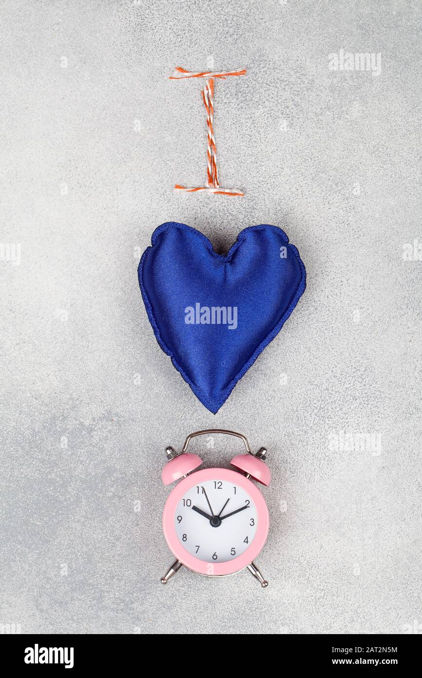 Love Times clock with blue heart symbol of loving on blue background ...