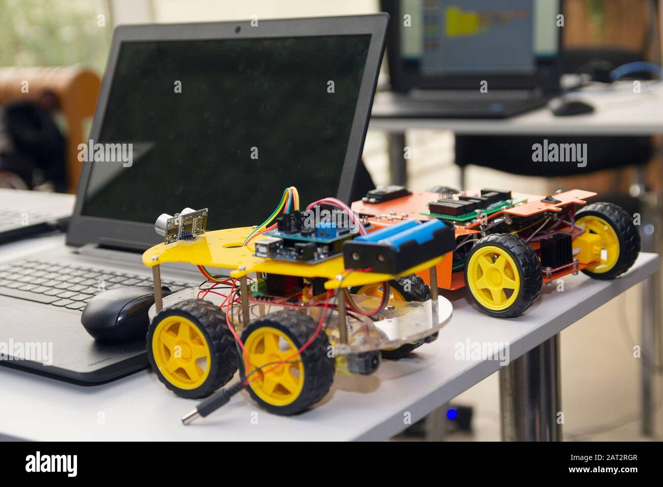Kit models and laptops on the table on robotics. Education Stock Photo ...