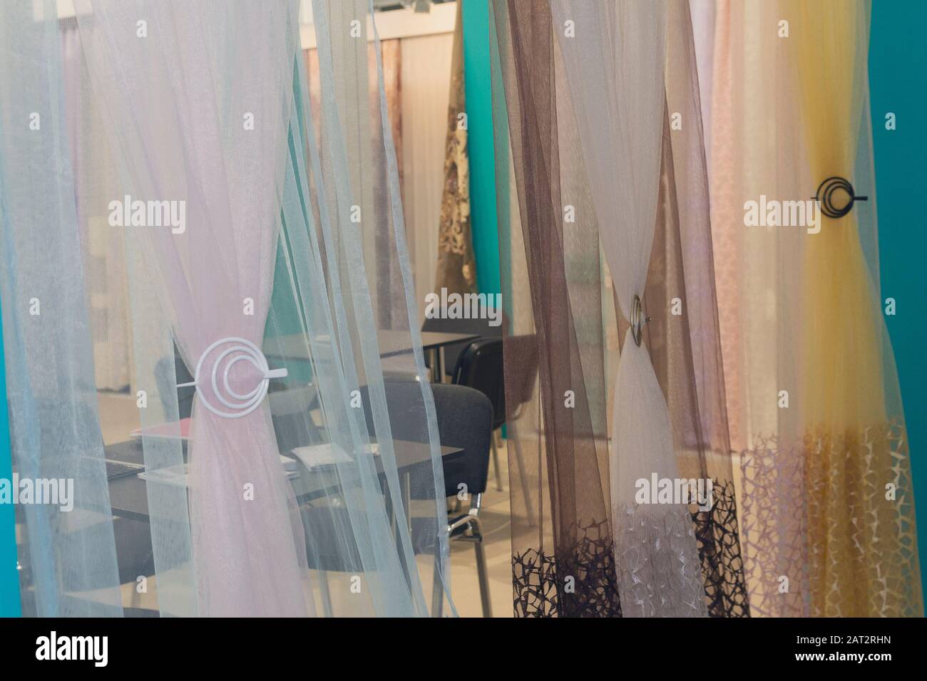 Beautiful multi-colored curtains in the exhibition hall Stock Photo - Alamy