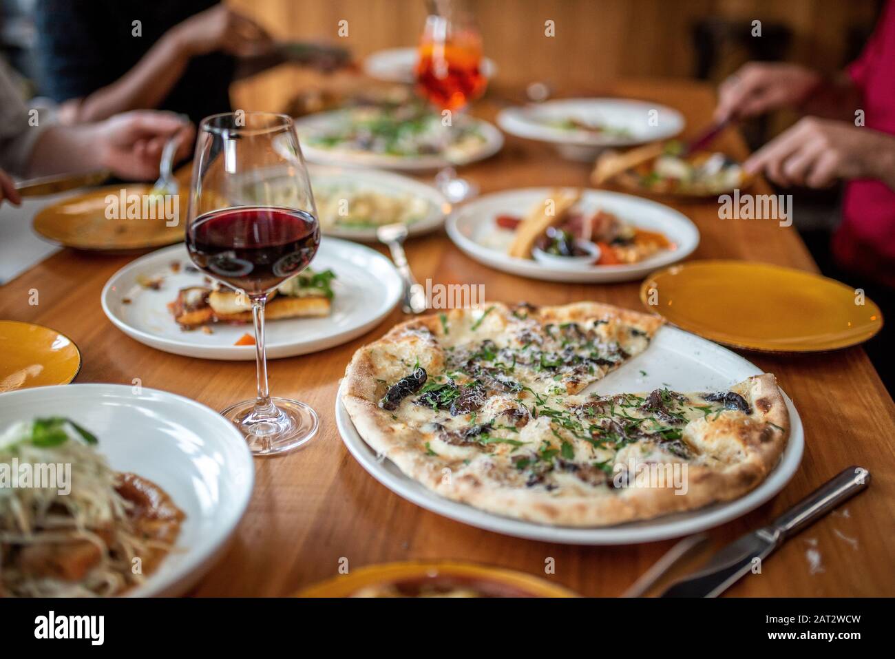 Italian meal being shared Stock Photo - Alamy
