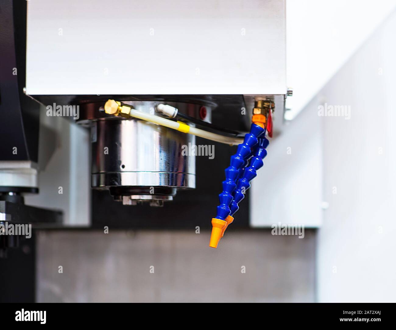 CNC lathe machine cooled by water during machining Stock Photo - Alamy