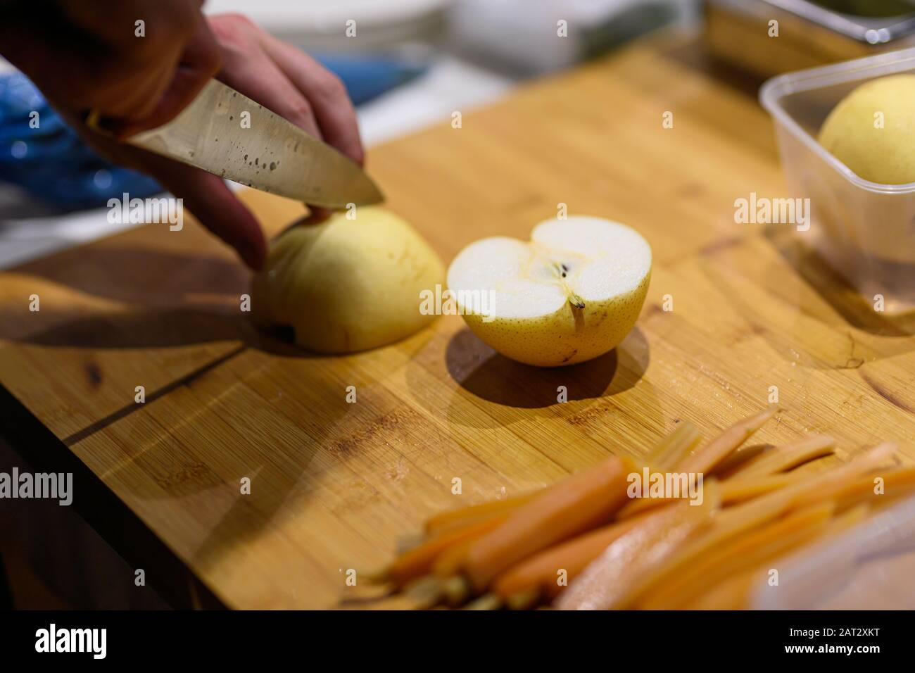 Man slicing Apple Stock Photo - Alamy