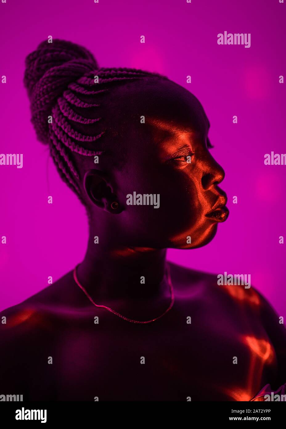 African woman portrait neon pink Stock Photo - Alamy