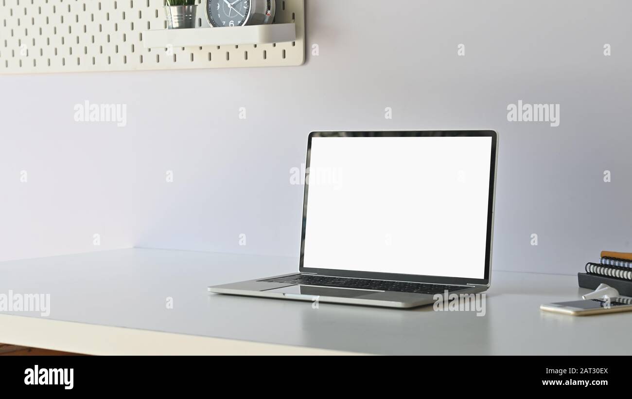 Mockup laptop computer on working table with empty screen display Stock ...