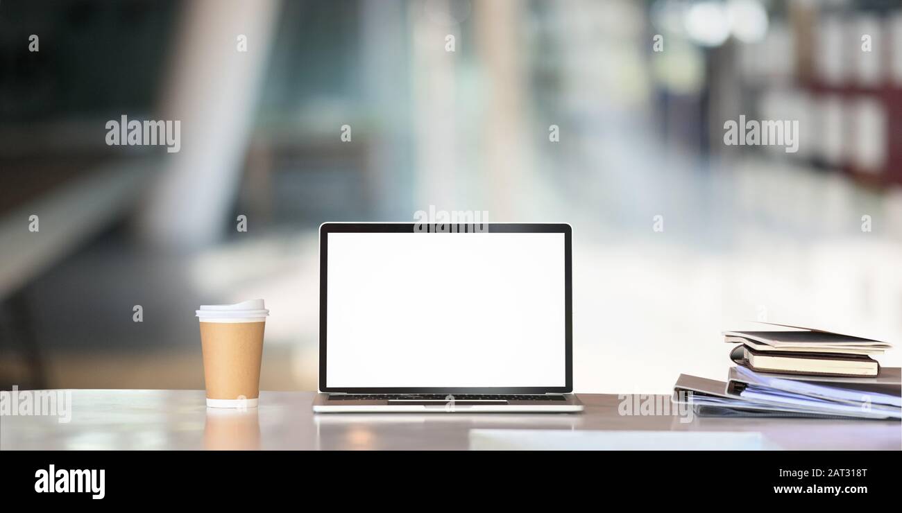 Mockup laptop computer, paper coffee cup, document file on business ...