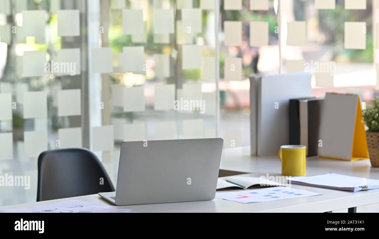 Workplace with notebook laptop Comfortable work table in modern office ...