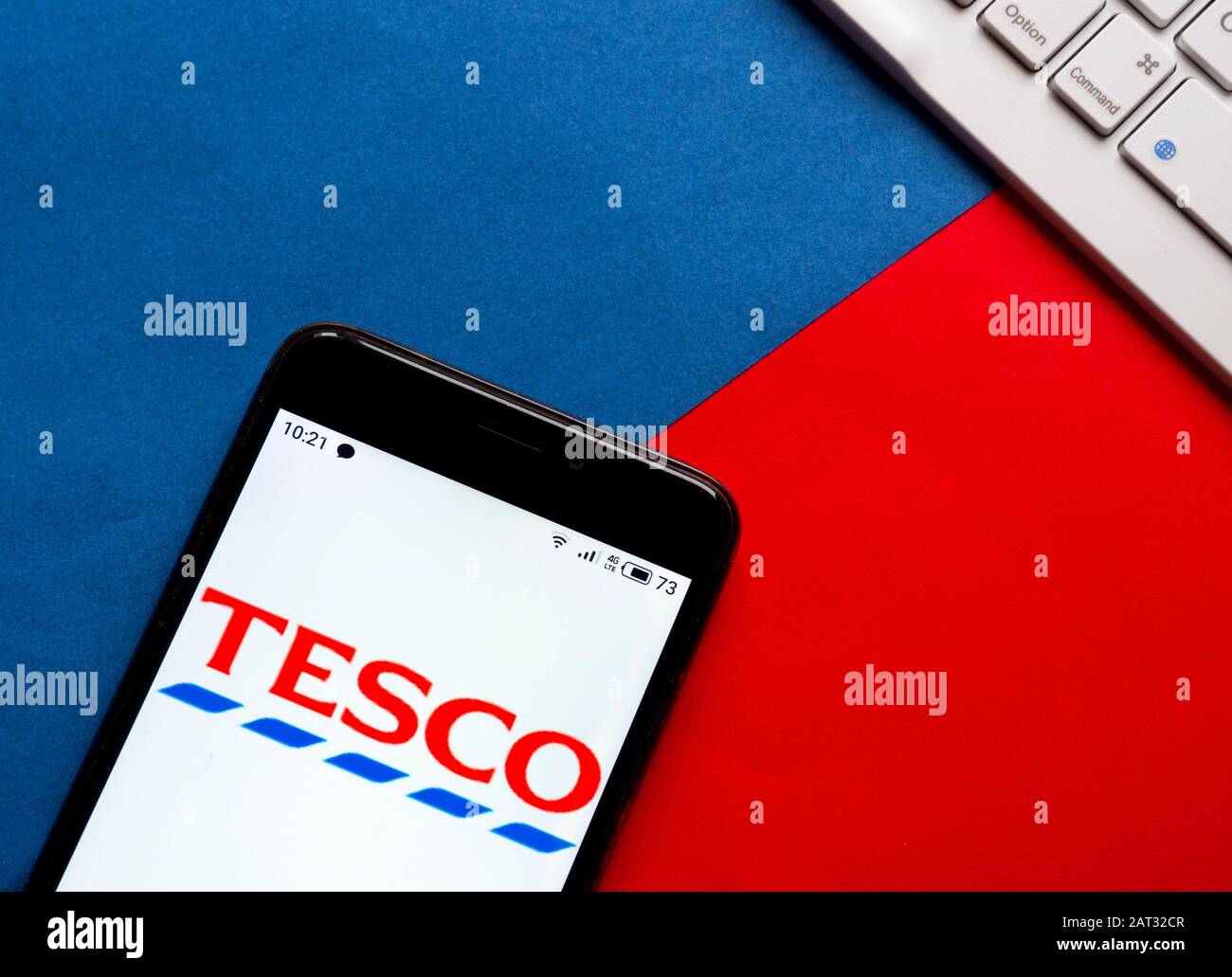 In this photo illustration a Tesco logo seen displayed on a smartphone ...