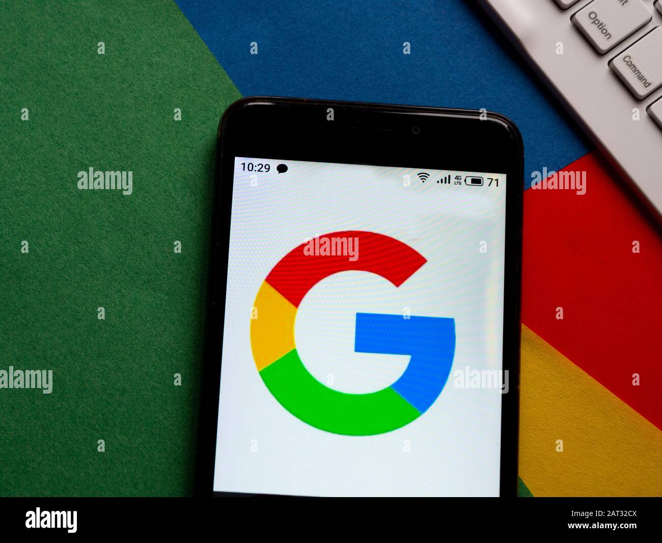 In this photo illustration a Google logo seen displayed on a smartphone ...