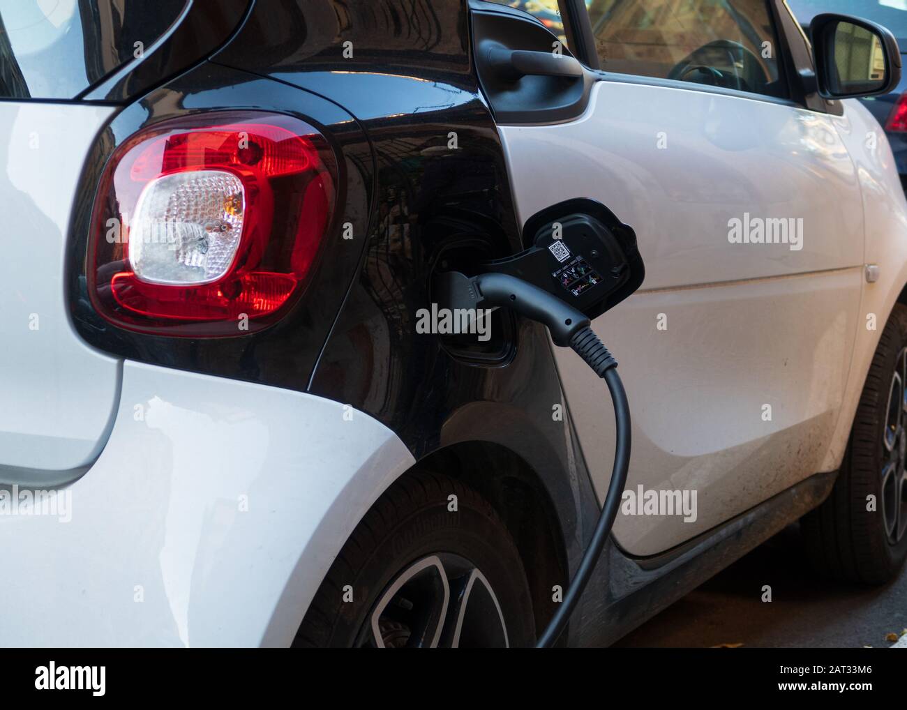 Rome, Italy - Dec 30, 2019: Smart electric car being charged from a ...