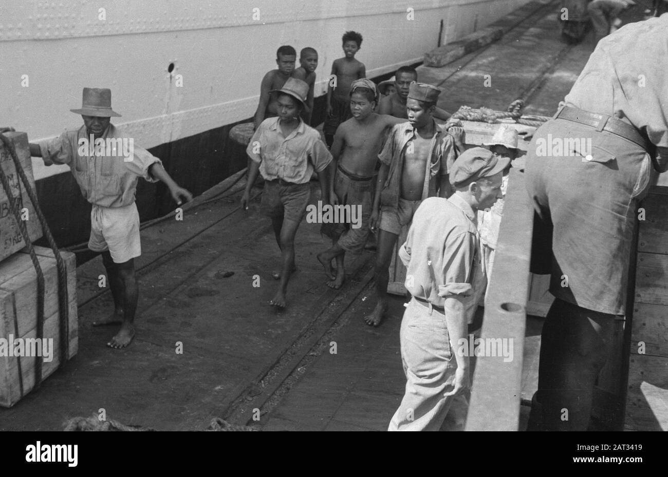 Quartermaster General at Priok [helping dock workers with lashing the ...