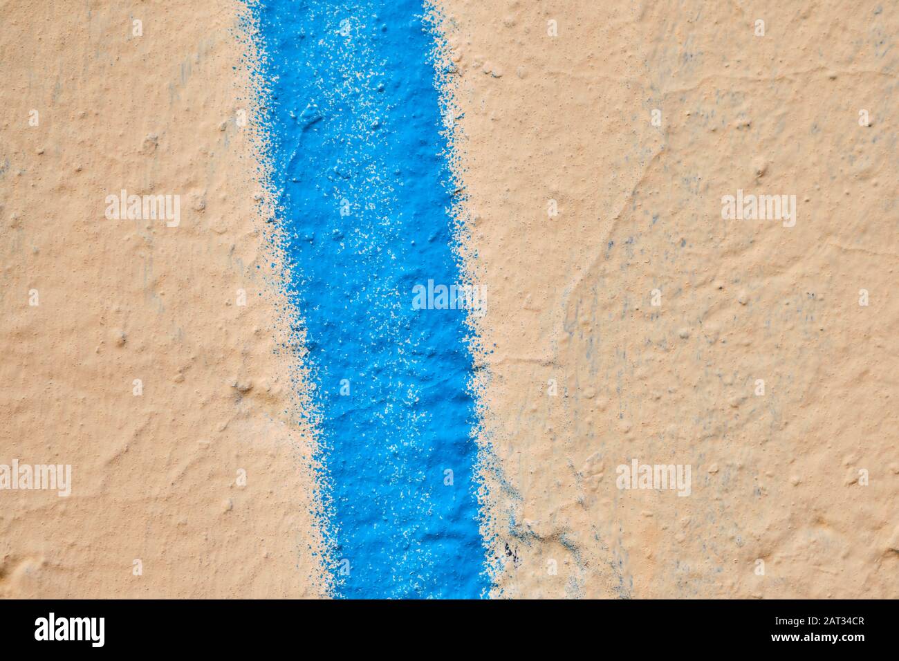 The wall is painted beige with a blue line. Background Stock Photo - Alamy