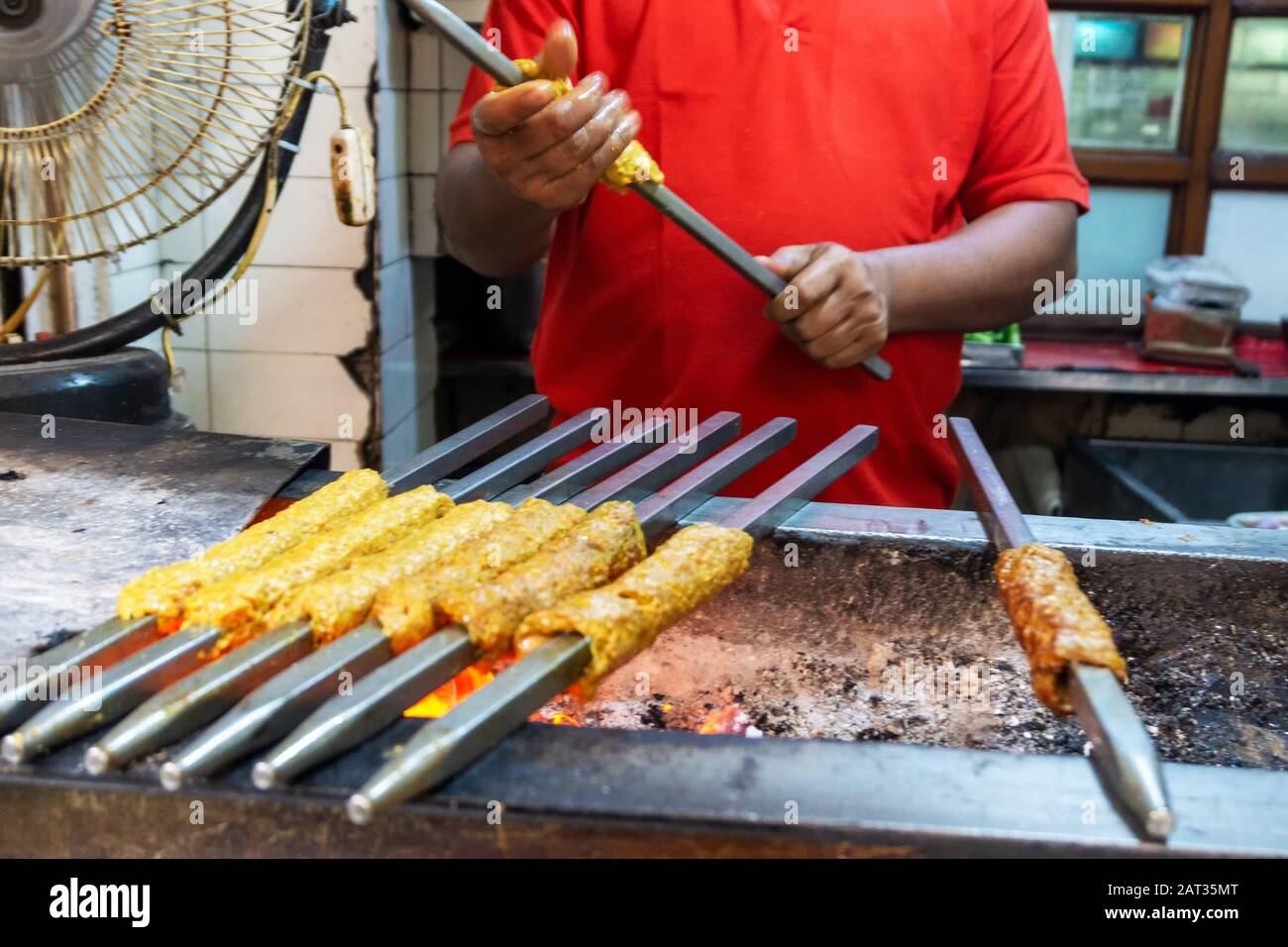 Unidentified Man grilling an Indian Chicken and Mutton Kebabs at ...