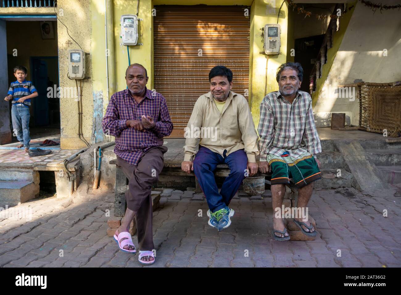 New Delhi, India - March 03, 2018: Indian men sitting outside their ...