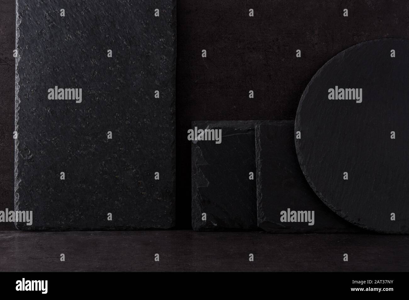 Black slate kitchenware background Stock Photo - Alamy