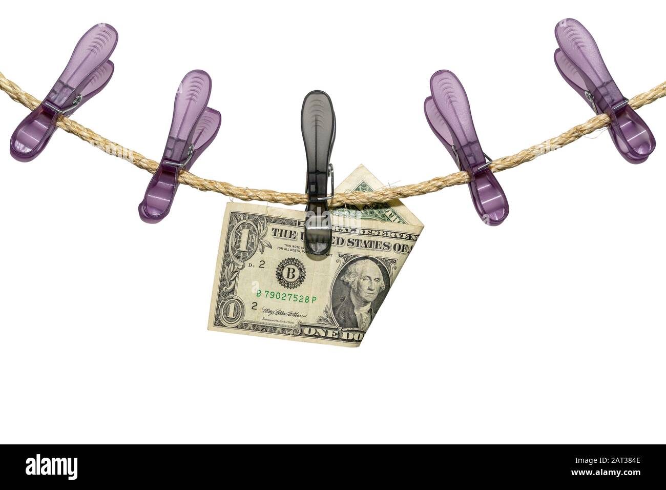 One US Dollar bill note on a washing line. Anti laundering finance ...