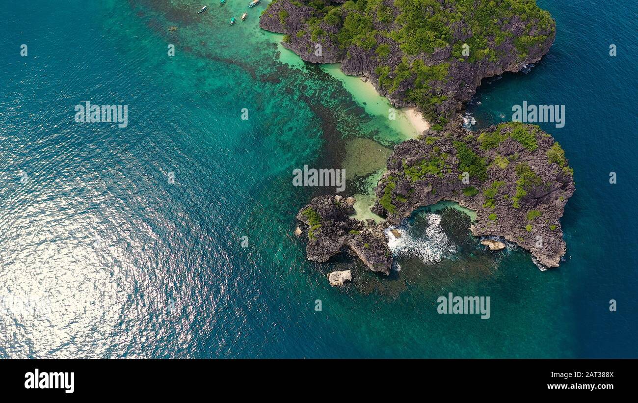 Tropical landscape: Lahos Island with beautiful beach and tourists by ...